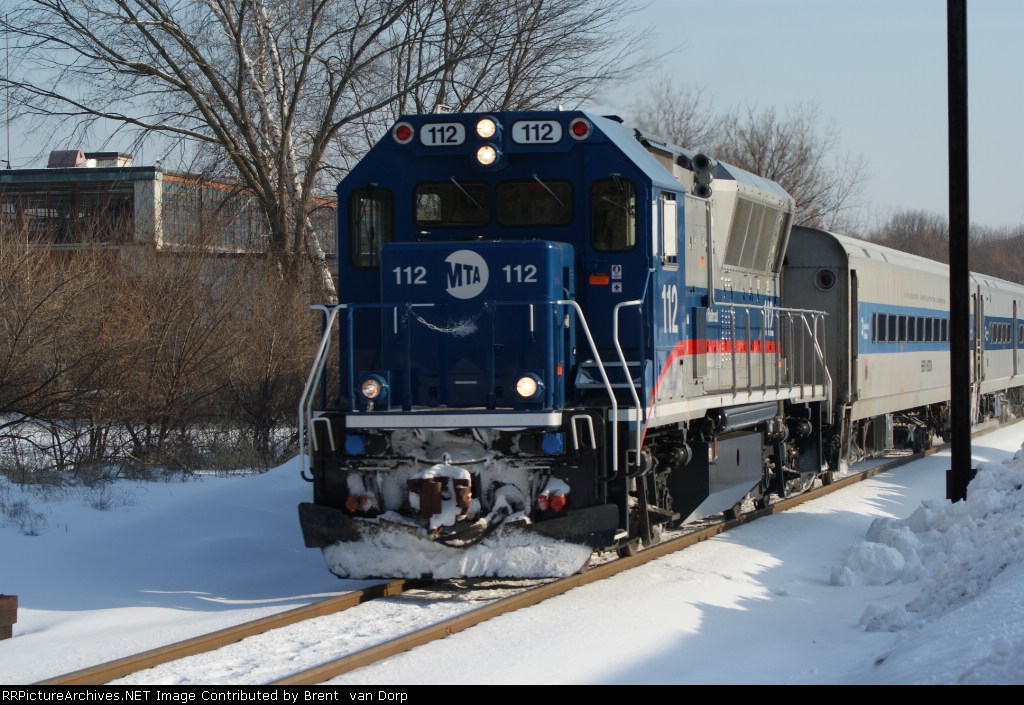 MNCR BL20GH 112 heads up northbound Danbury train 1830 at Shelter Rock Rd.